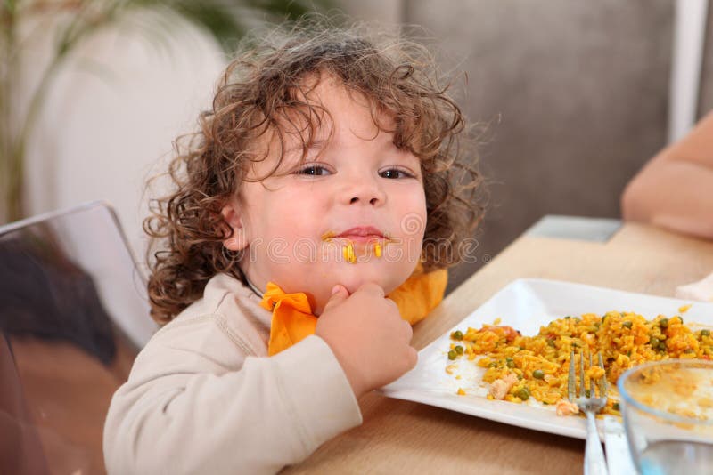Little boy eating rice= stock image. Image of messy, cute - 35737877