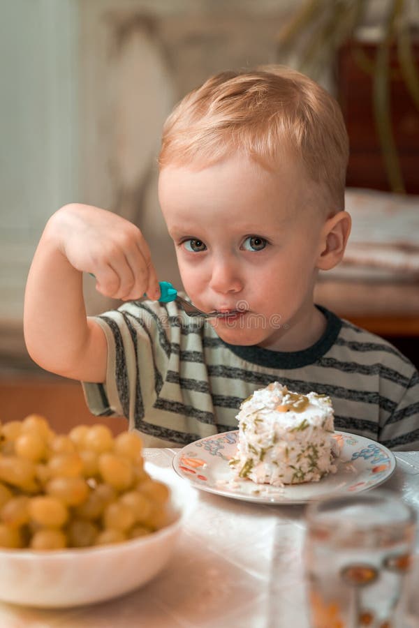 A Little Boy Eats Cake on His Birthday. Stock Image - Image of infant ...
