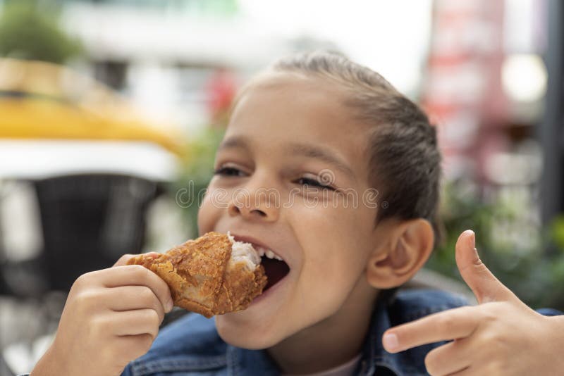 Little Boy Eats Fried Chicken Stock Image - Image of delicious, eats ...