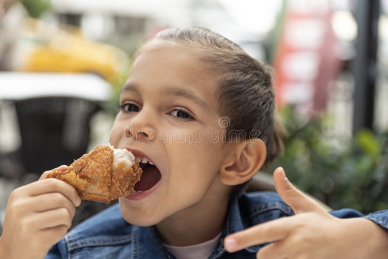 173 Little Kid Eat Fried Chicken Stock Photos - Free & Royalty-Free ...