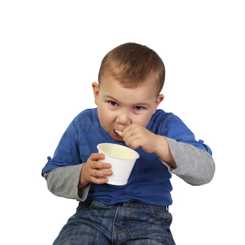 Little boy eats yogurt stock image. Image of natural - 78759235