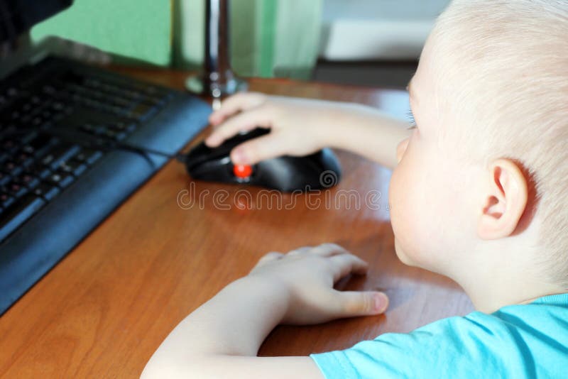 A Little Boy is Engaged at the Computer Stock Image - Image of display ...