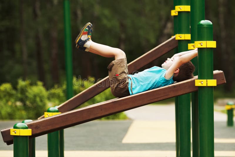 Little Boy Exercise on the Playground Stock Image - Image of physical ...