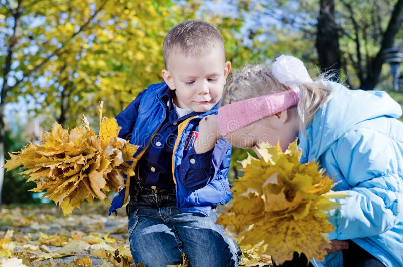 Little boy fascinated by crawling insect, Little boy fascinated by an ...