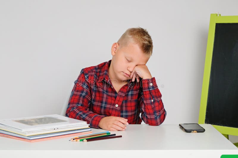 Little Boy Feeling Tired Bored and Sleepy Doing School Homework at the ...