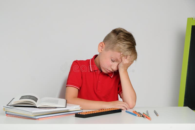Little Boy Feeling Tired Bored and Sleepy Doing School Homework at the ...