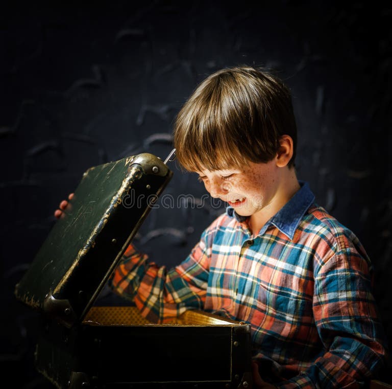 Little Boy Finding Treasure Stock Image - Image of emotive, hide: 44487799