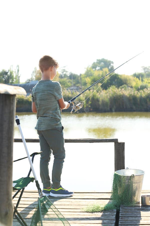 Man Fishing Alone at Riverside on Sunny Da Stock Image - Image of reel ...