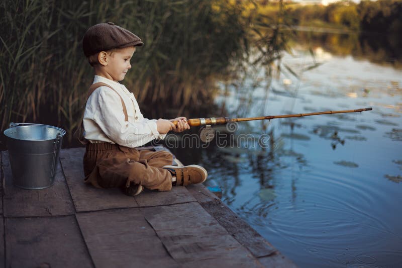 Little Boy Fishing at Sunset Stock Image - Image of hobby, leisure ...