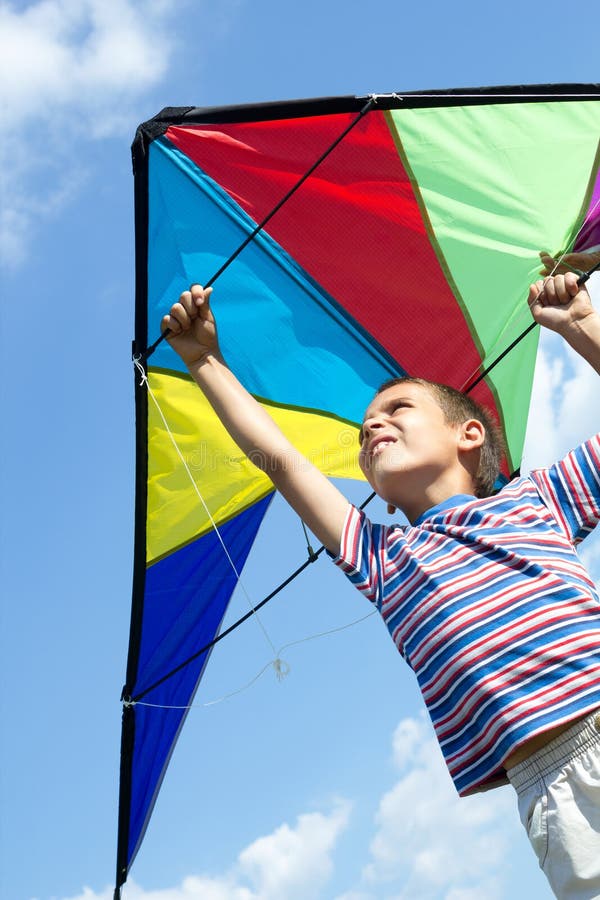 Little Boy Flies a Kite into the Blue Sky Stock Photo - Image of ...