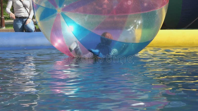 Little Boy Flounders Inside a Big Inflatable Ball Stock Footage - Video ...
