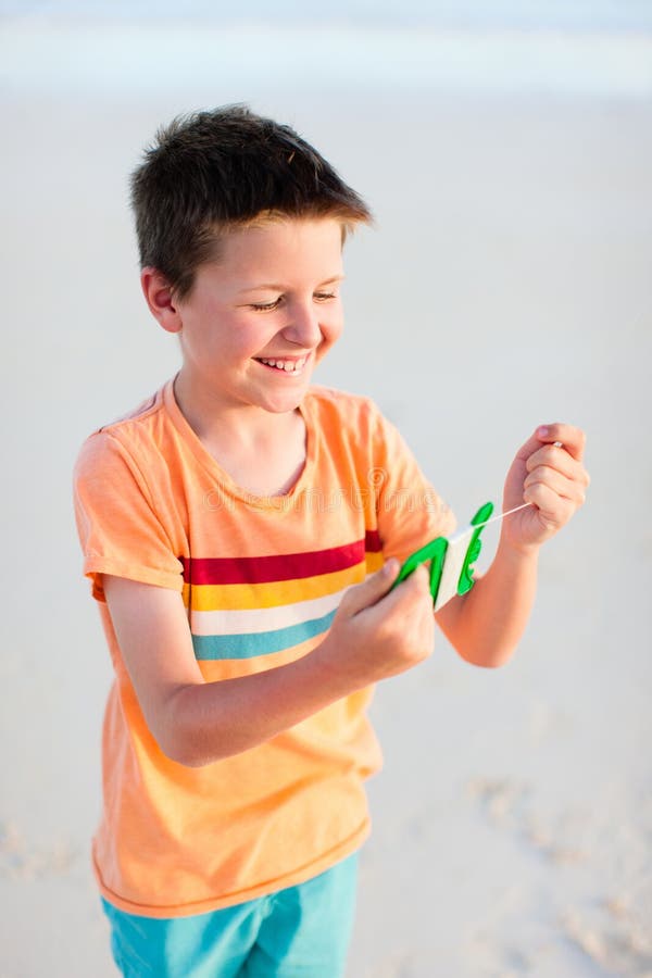 Little boy flying a kite stock image. Image of activity - 37889687