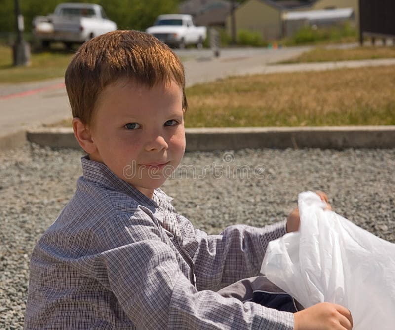 Young Boy Picking Up Garbage - Ecology Stock Photo - Image of child ...