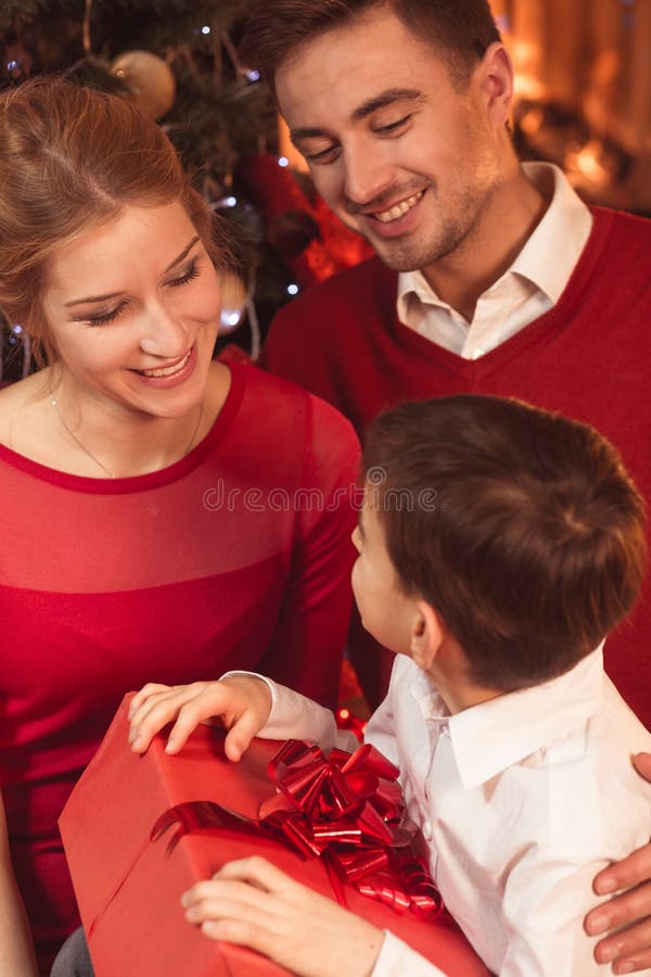 Little Boy Getting Christmas Gift Stock Image - Image of family, giving ...