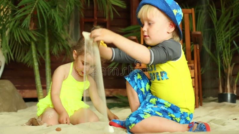 Little Boy and Girl are Playing with Shell in Stock Footage - Video of ...