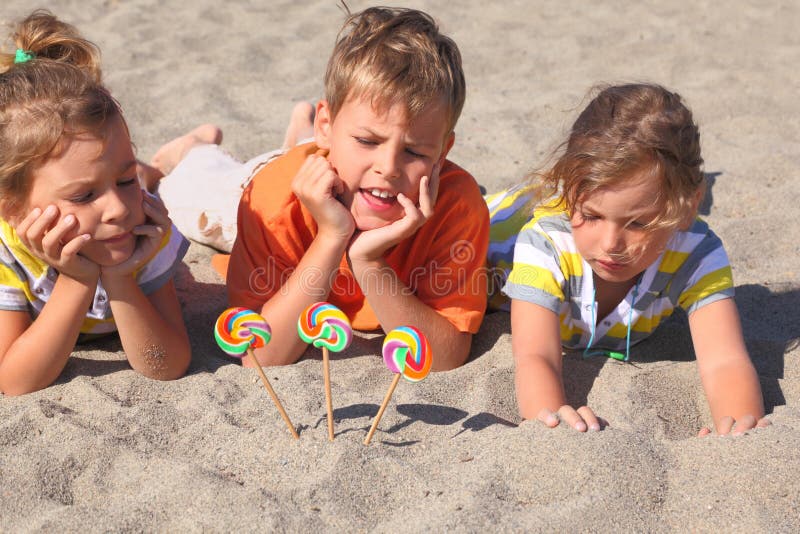 Little Boy and Girls Lying on Beach Stock Image - Image of little ...