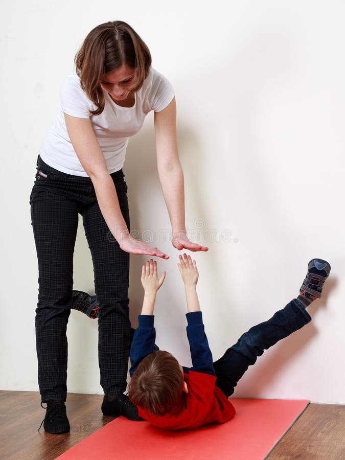 Little Boy is Going an Exercise on a Mat Stock Photo - Image of ...