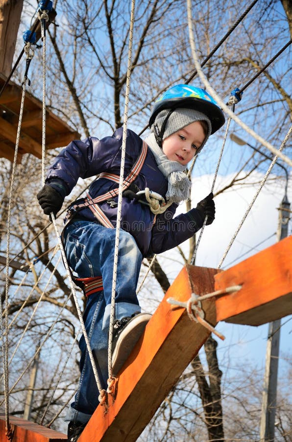 Little Boy Going on Suspension Way and Looking Down. Vertical, S Stock ...