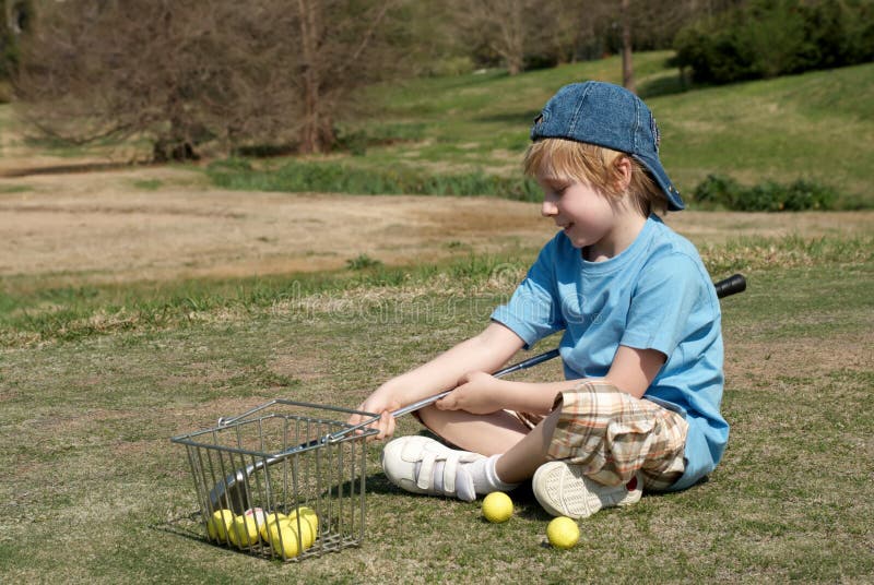 Little boy on a golf field stock photo. Image of outdoor - 11169230