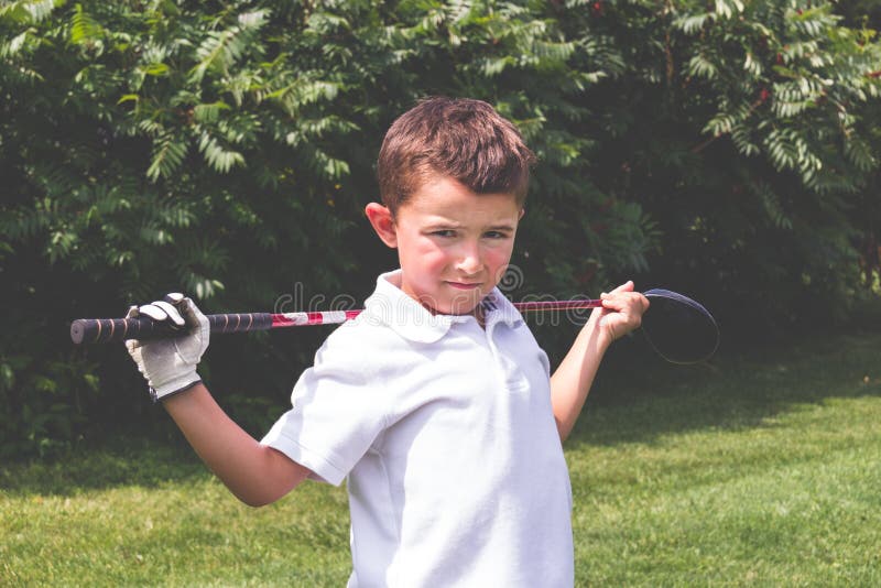 Little Boy Golfer with Driver Club Over Shoulders Posing for Cam Stock ...