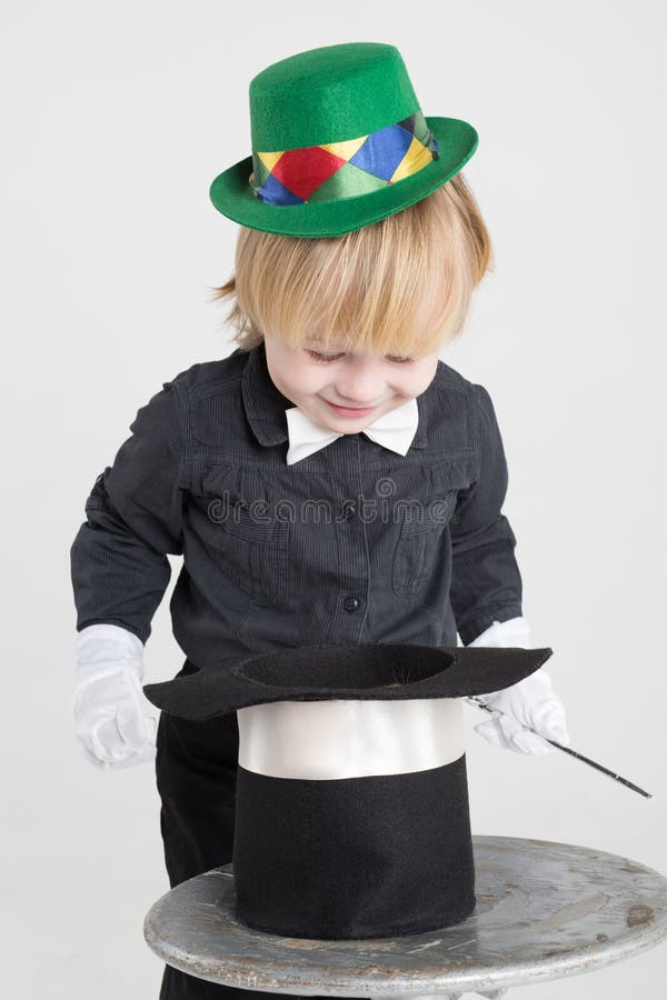 A Little Boy in Green Hat and with a Magic Stock Photo - Image of stick ...