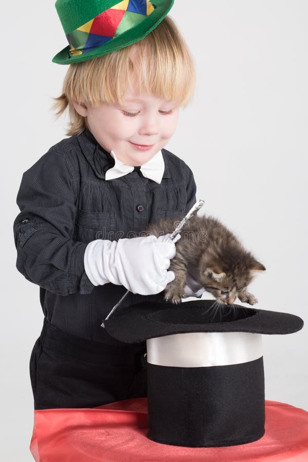 A Little Boy in a Green Hat and with Magic Wand Stock Photo - Image of ...