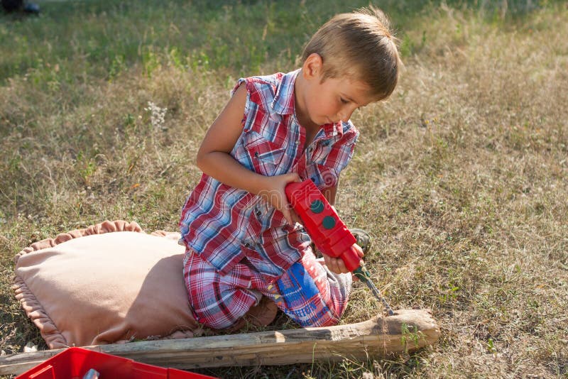 Little boy hard at work stock image. Image of loud, joyful - 44778819