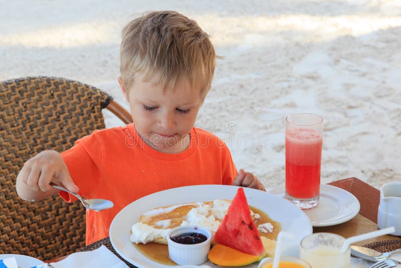 Little Boy Having Breakfast at the Resort Stock Image - Image of casual ...
