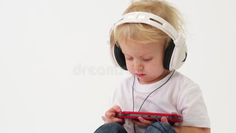 Little Boy with Headphones Playing the Game Stock Video - Video of game ...