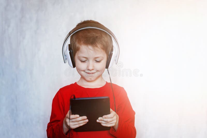 Little Boy with Headset Using Touch Pad, Early Education and Pla Stock ...