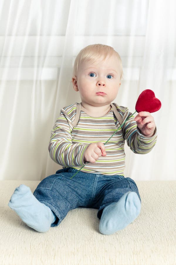 Little boy with heart stock photo. Image of hand, pretty - 12571312