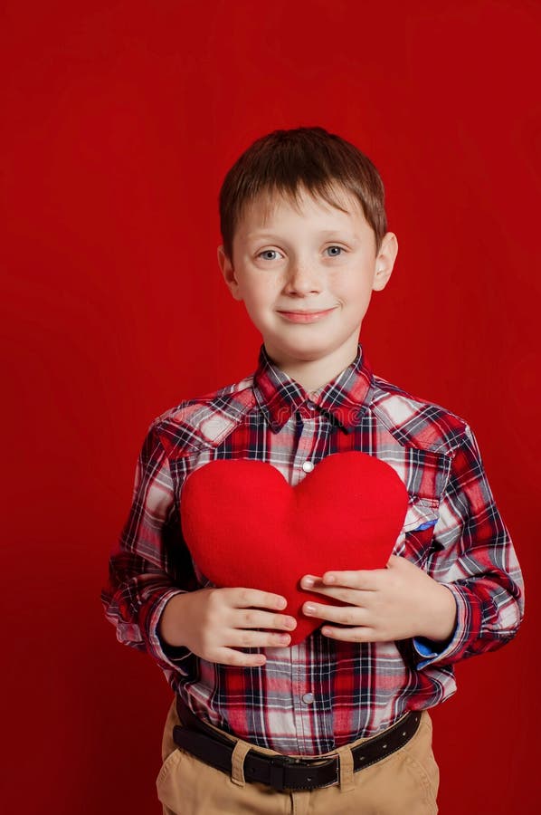 Little Boy with a Heart of Toy Stock Photo - Image of holiday, family ...