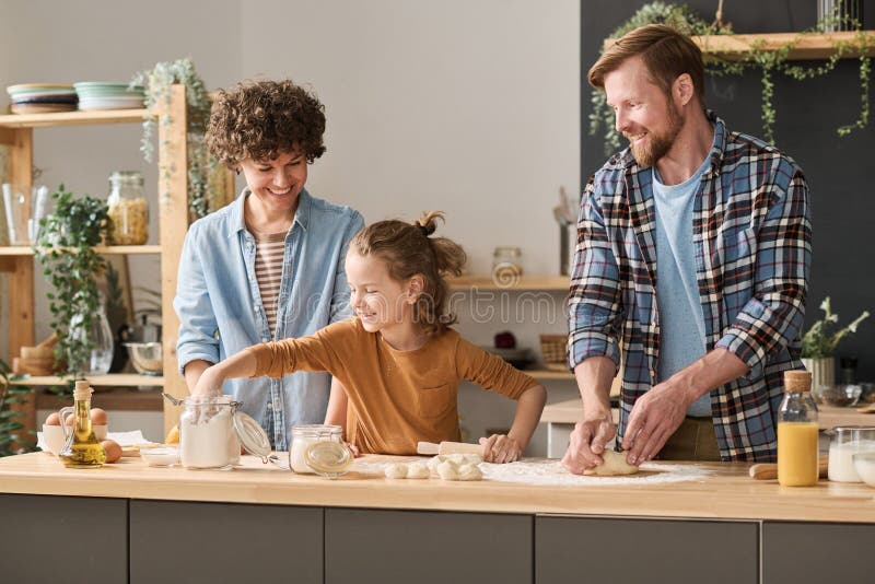 Little Boy Helping His Parents To Bake Buns Stock Photo - Image of ...