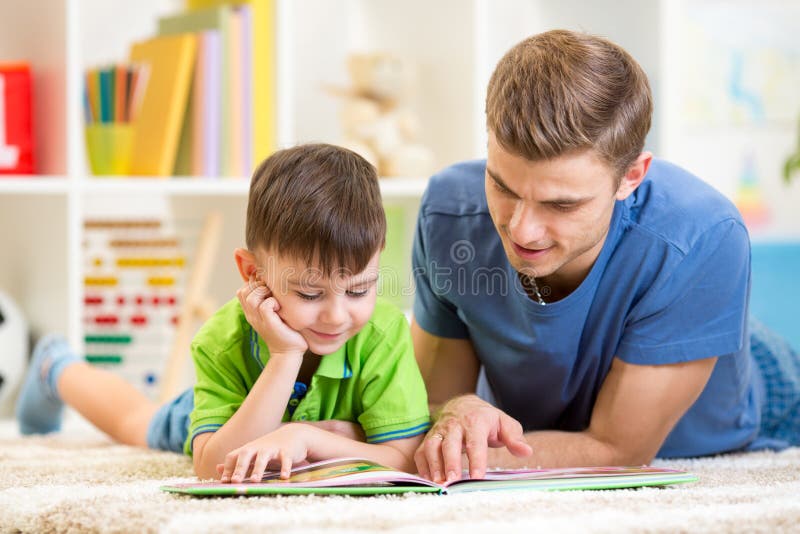 Little Boy and His Dad Read Book Together Stock Image - Image of ...