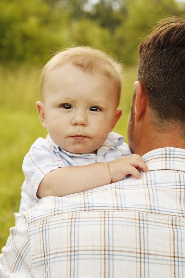 Little Boy with His Father on the Nature Stock Photo - Image of hands ...