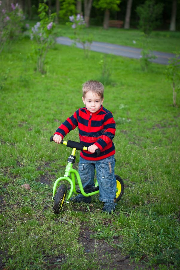 Little Boy on His First Bike Stock Photo - Image of hair, family: 54336626