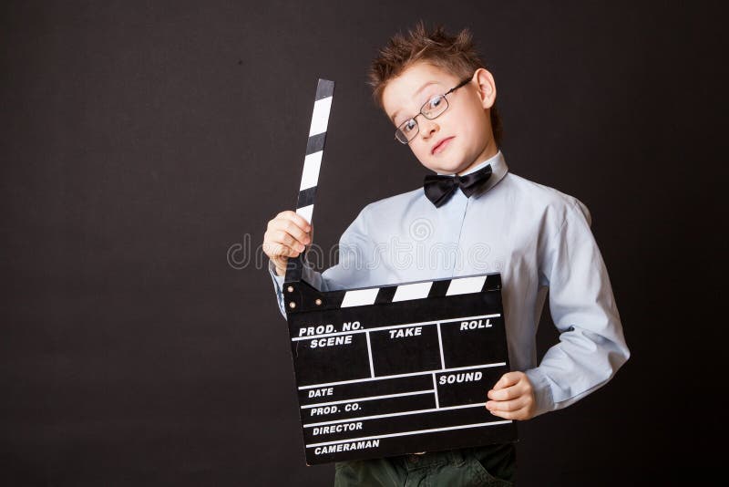 Little Boy Holding Clapper Board in Hands. Stock Photo - Image of ...