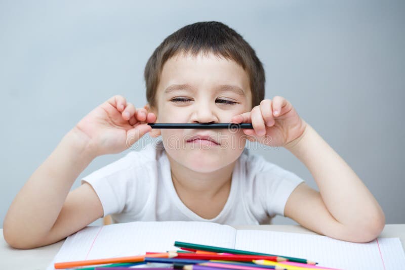 Little Boy is Holding Color Pencils Stock Image - Image of focused ...