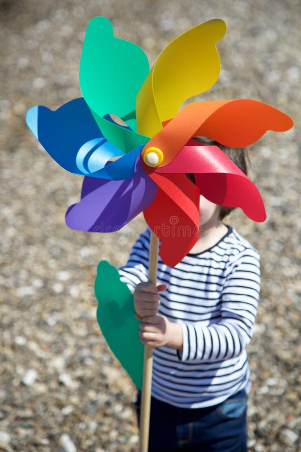 Little Boy Holding Colored Pinwheel Stock Image - Image of childhood ...