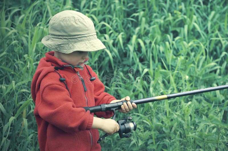 532 Little Boy Holding Fishing Rod Stock Photos - Free & Royalty-Free ...