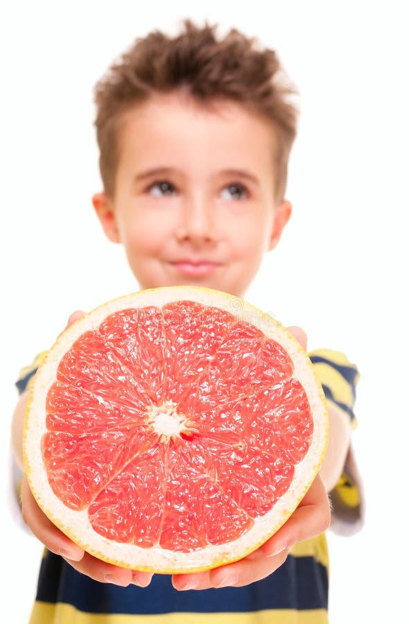 Little Boy Holding Grapefruit Stock Photo - Image of grapefruit ...