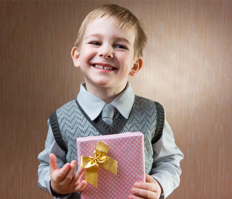 Little boy holding present stock image. Image of celebration - 34754465