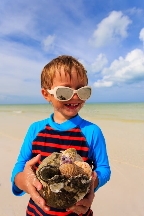 Little Boy Holding Seashells on Summer Tropical Stock Photo - Image of ...