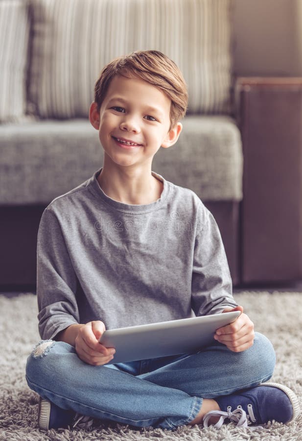 Little boy at home stock photo. Image of computer, carpet - 81349126