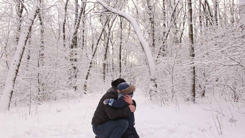 A Little Boy Hugging and Kissing His Grandmother at Home on the Couch ...