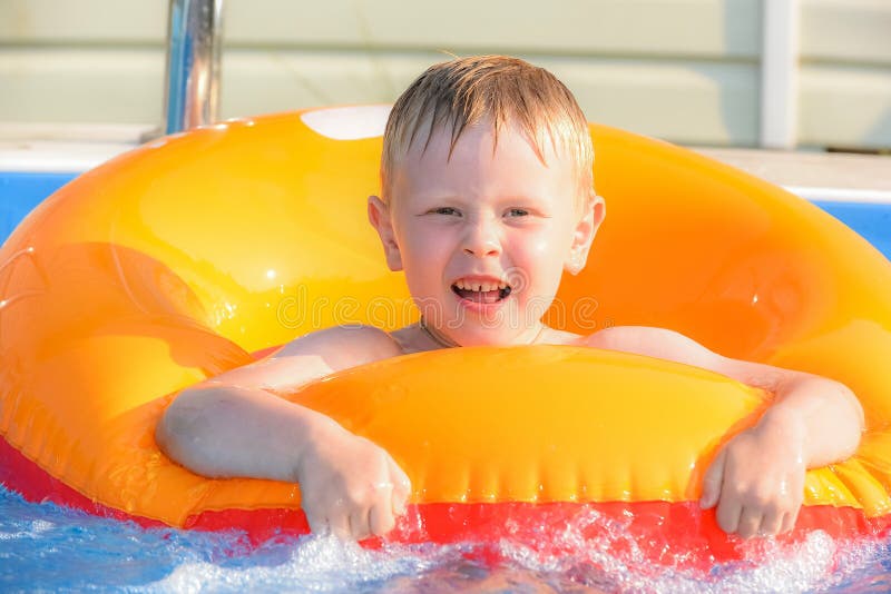 Little Boy on an Inflatable Circle in the Water Stock Photo - Image of ...