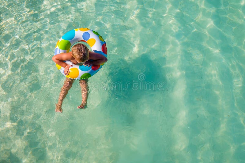 Little Boy in Inflatable Ring Floating in the Water Stock Image - Image ...
