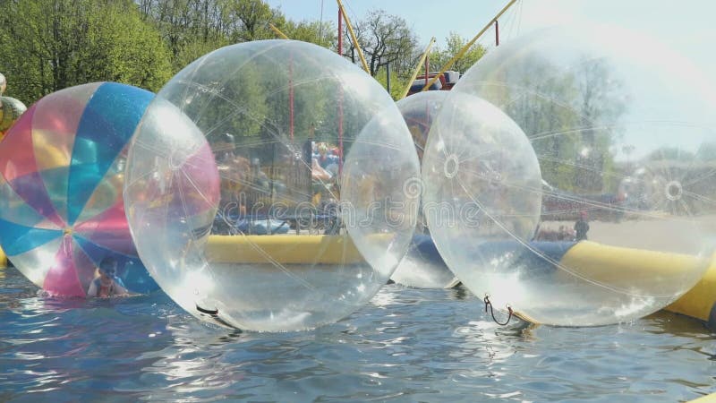 Little Boy Inside a Big Inflatable Ball in Water Stock Footage - Video ...