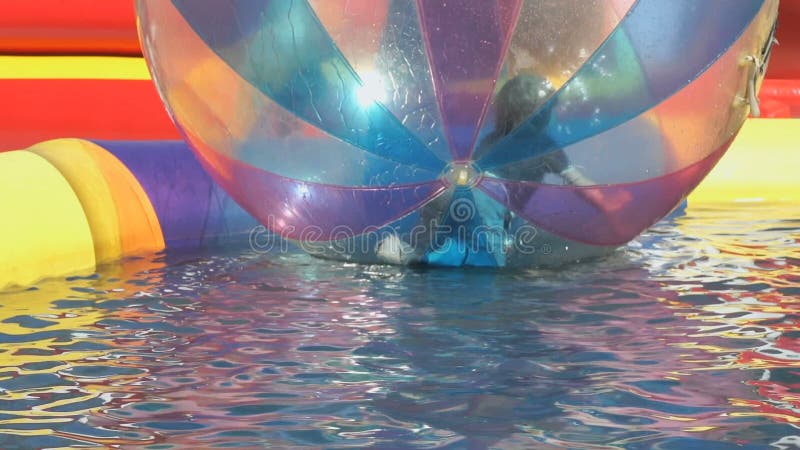 Little Boy Inside a Big Inflatable Ball in Water Stock Footage - Video ...