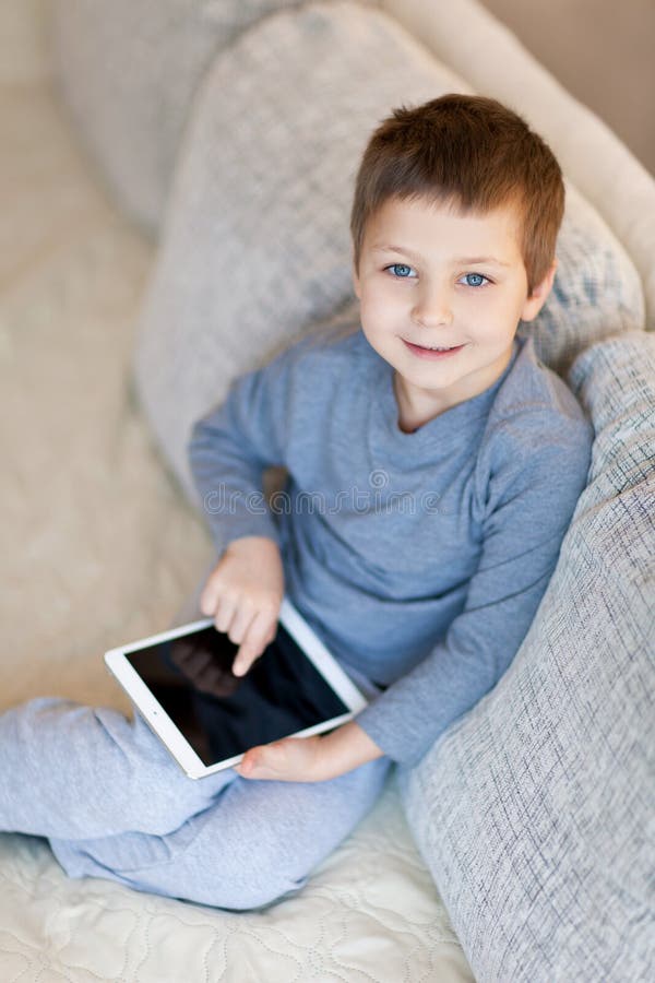 Little boy with iPad stock image. Image of board, hold - 58425567